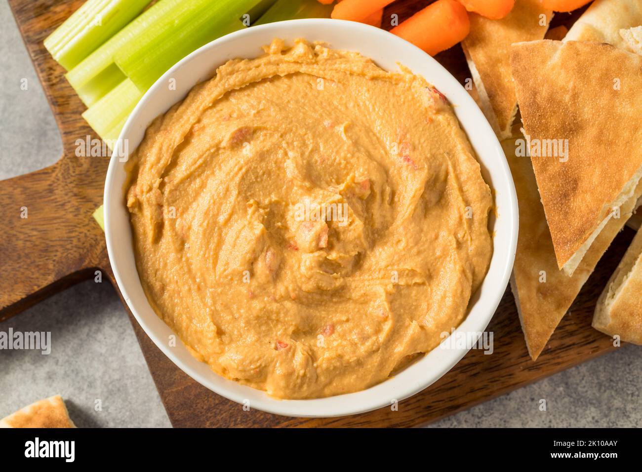Homemade Red Pepper Hummus Dip with PIta and Veggies Stock Photo - Alamy