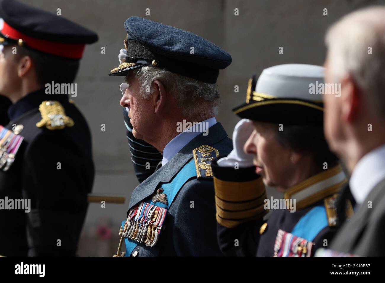 King Charles III and the Princess Royal salute as they pass the ...