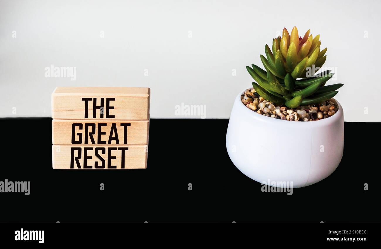 Wooden blocks with the inscription The great reset on a white and black ...