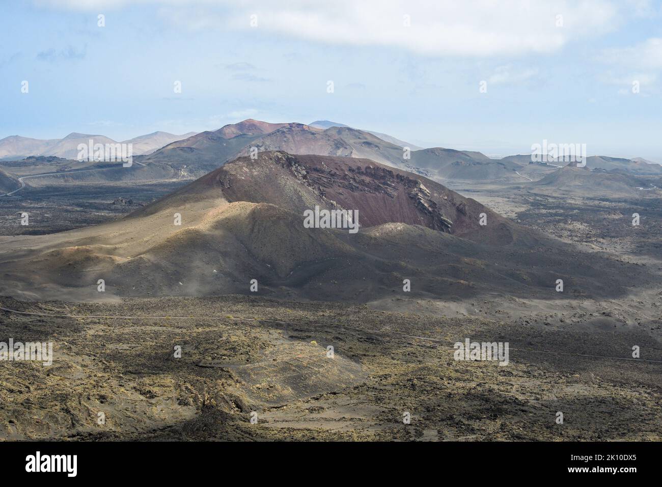 Volcanoes, black lava and islets of Lanzarote seen from Caldera Blanca ...