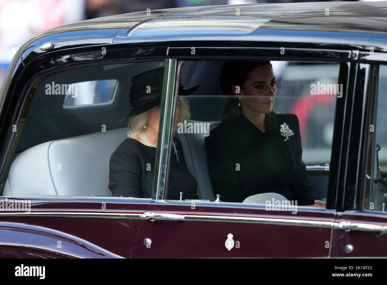 The Queen Consort and the Princess of Wales during the procession as ...