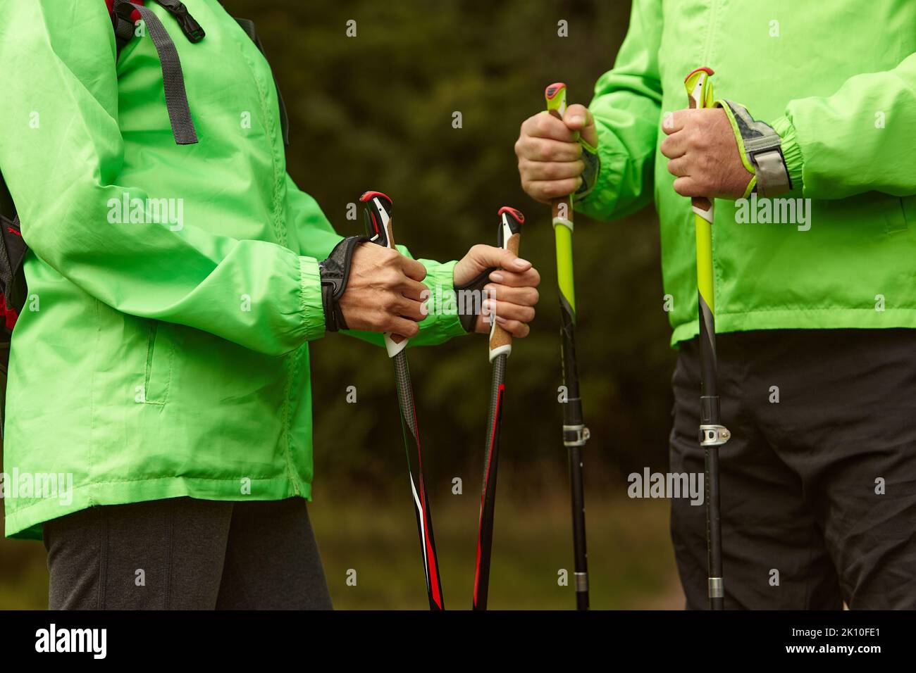 Closeup. Cropped image of two people in light sports jackets holding ...