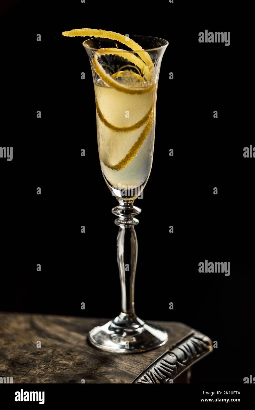 french 75 champagne cocktail with lemon twist garnish in flute glass ...