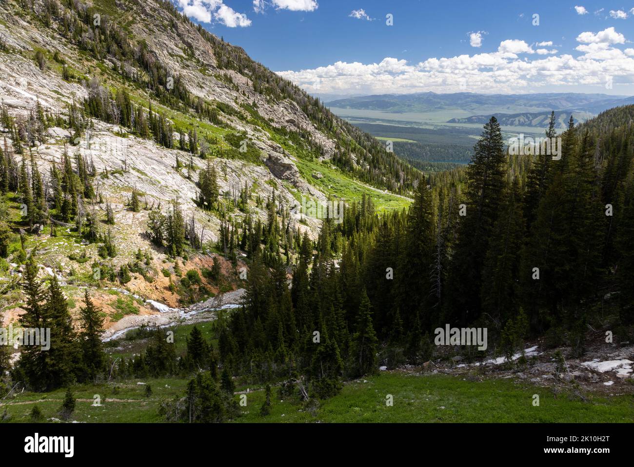 The rocky walls of Open Canyon rising high above the valley of Jackson ...