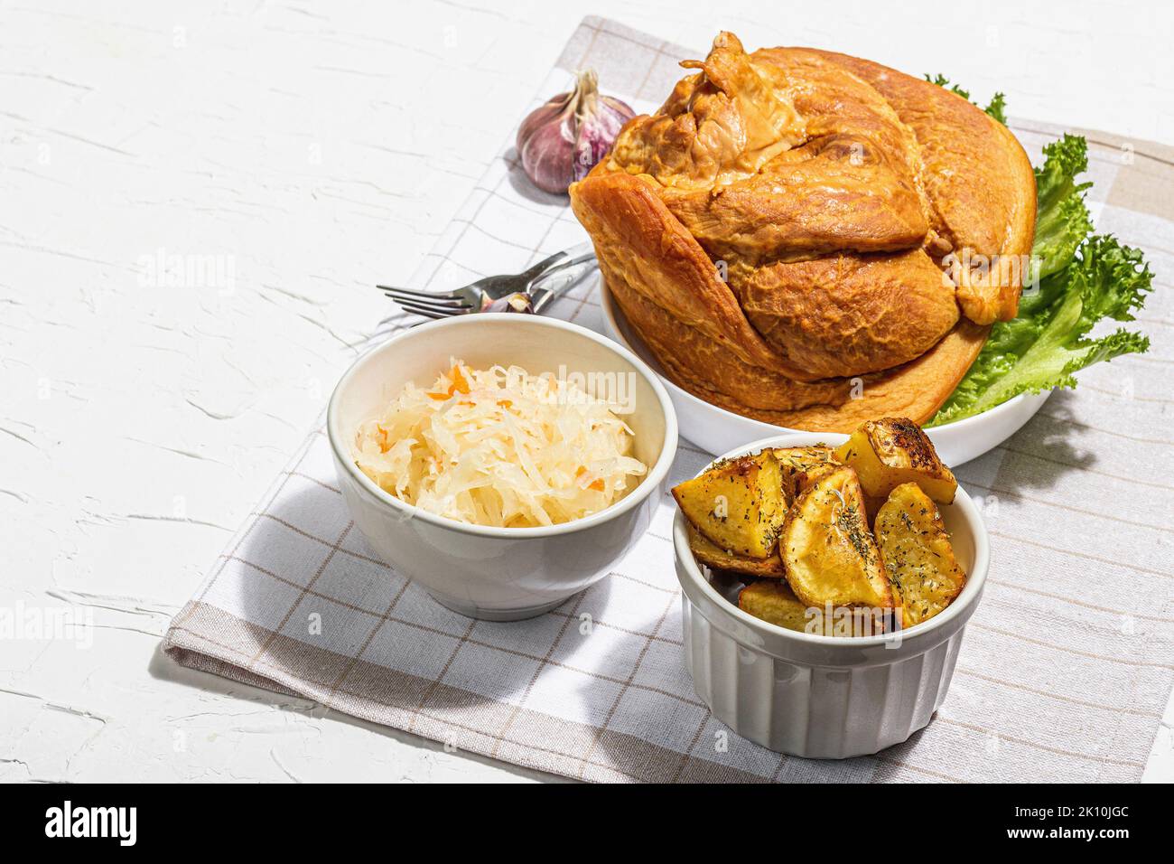 Traditional Oktoberfest smoked pork knuckle eisbein, fermented sour ...