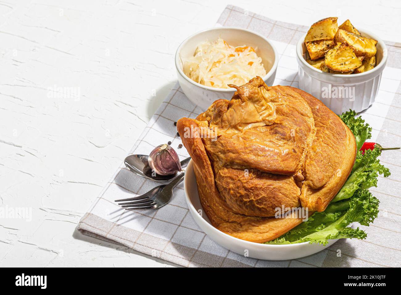 Traditional Oktoberfest smoked pork knuckle eisbein, fermented sour ...