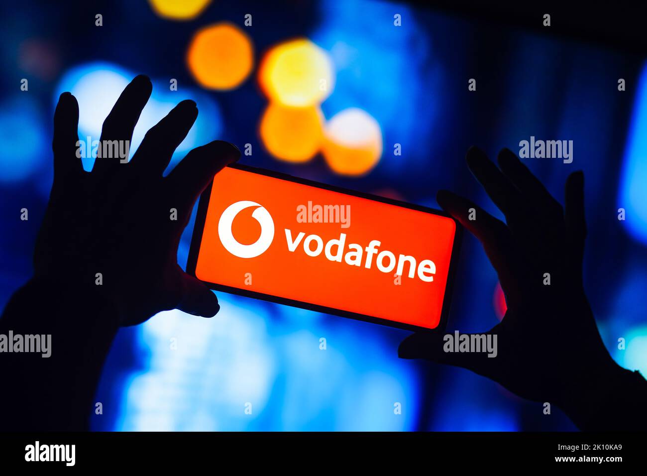In this photo illustration, the Vodafone logo is seen displayed on a ...