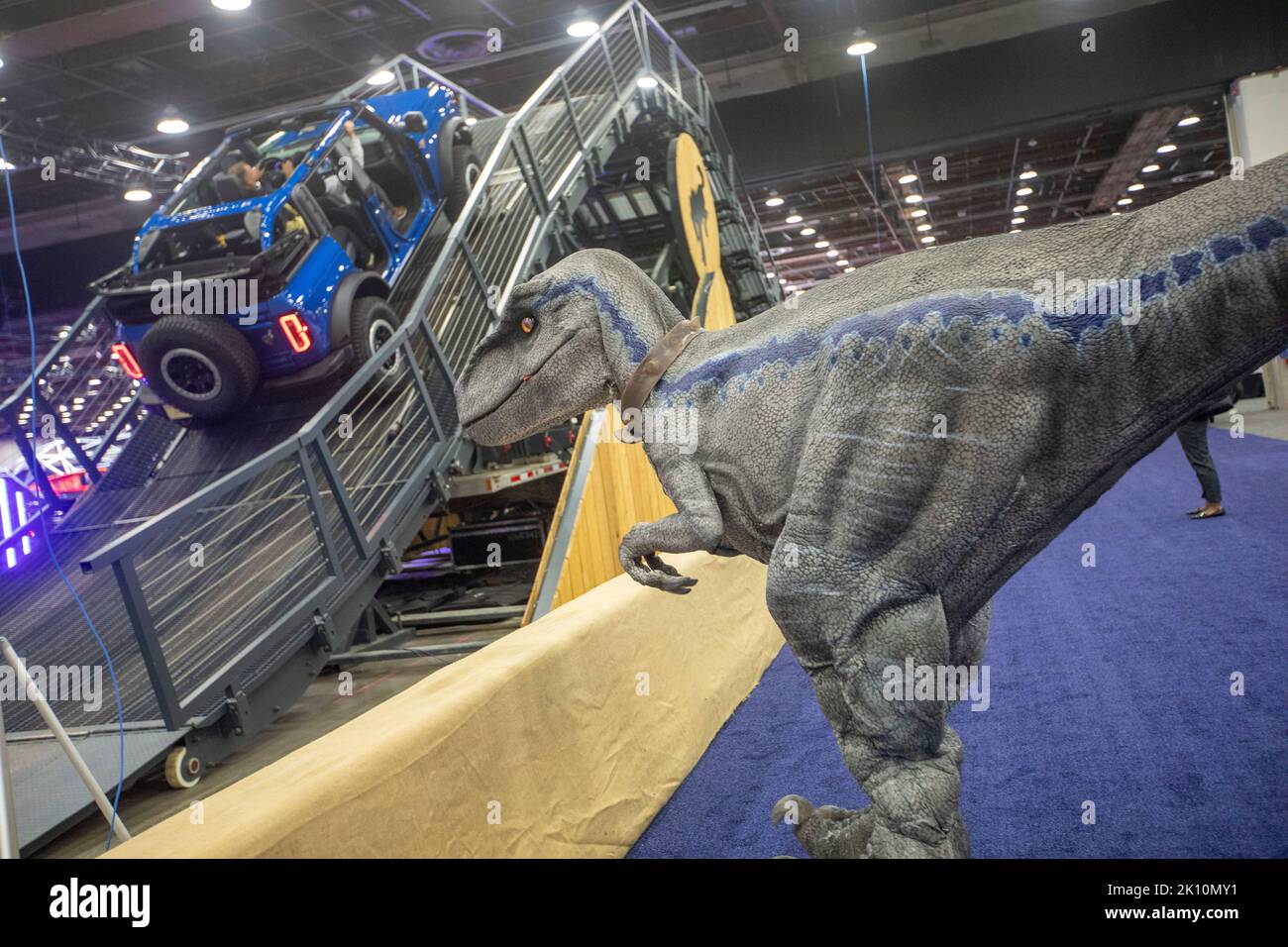 Detroit, Michigan, USA. 14th Sep, 2022. A dinosaur watches as a Ford ...