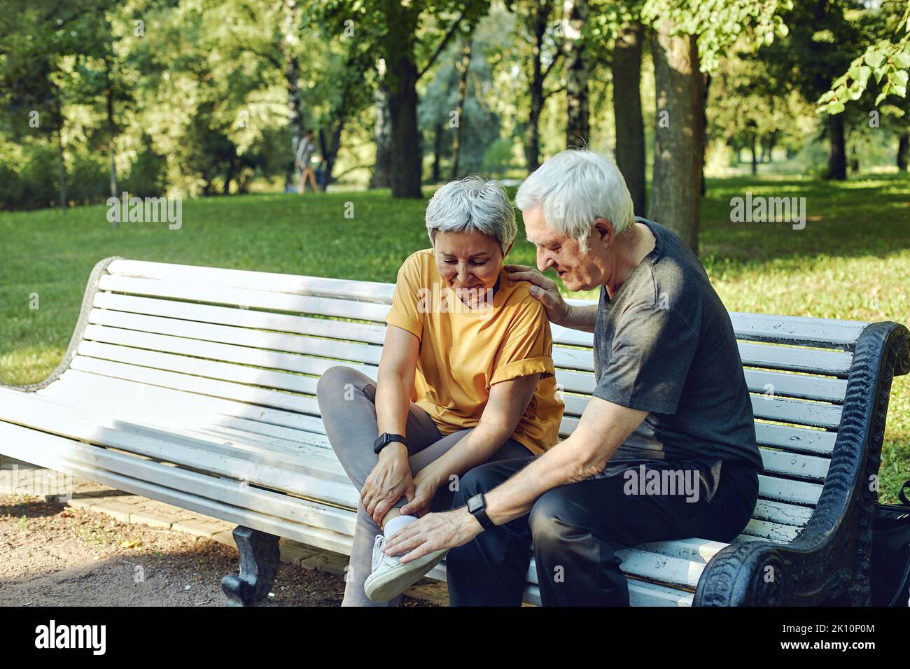 Elderly 60s woman got injured her ankle during morning stroll in summer ...