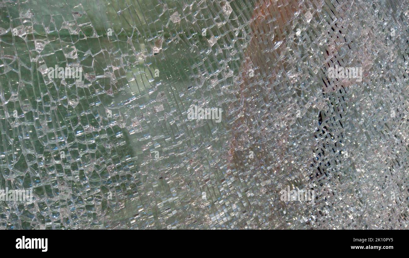 Strained glass broken window from explosion splinter. Shattered glass ...