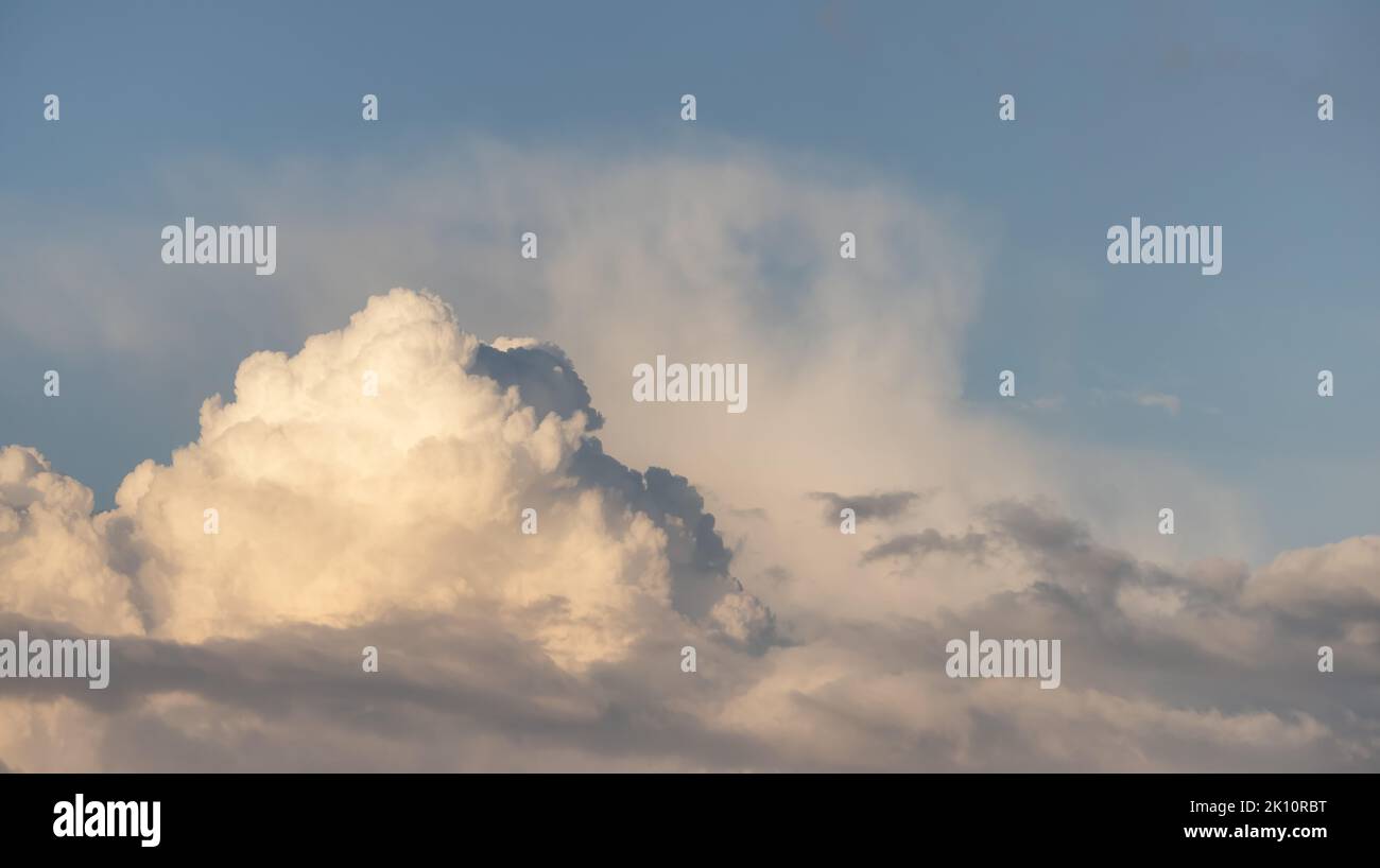 Puff Clouds in the Sky during sunset. Zoom in Stock Photo - Alamy