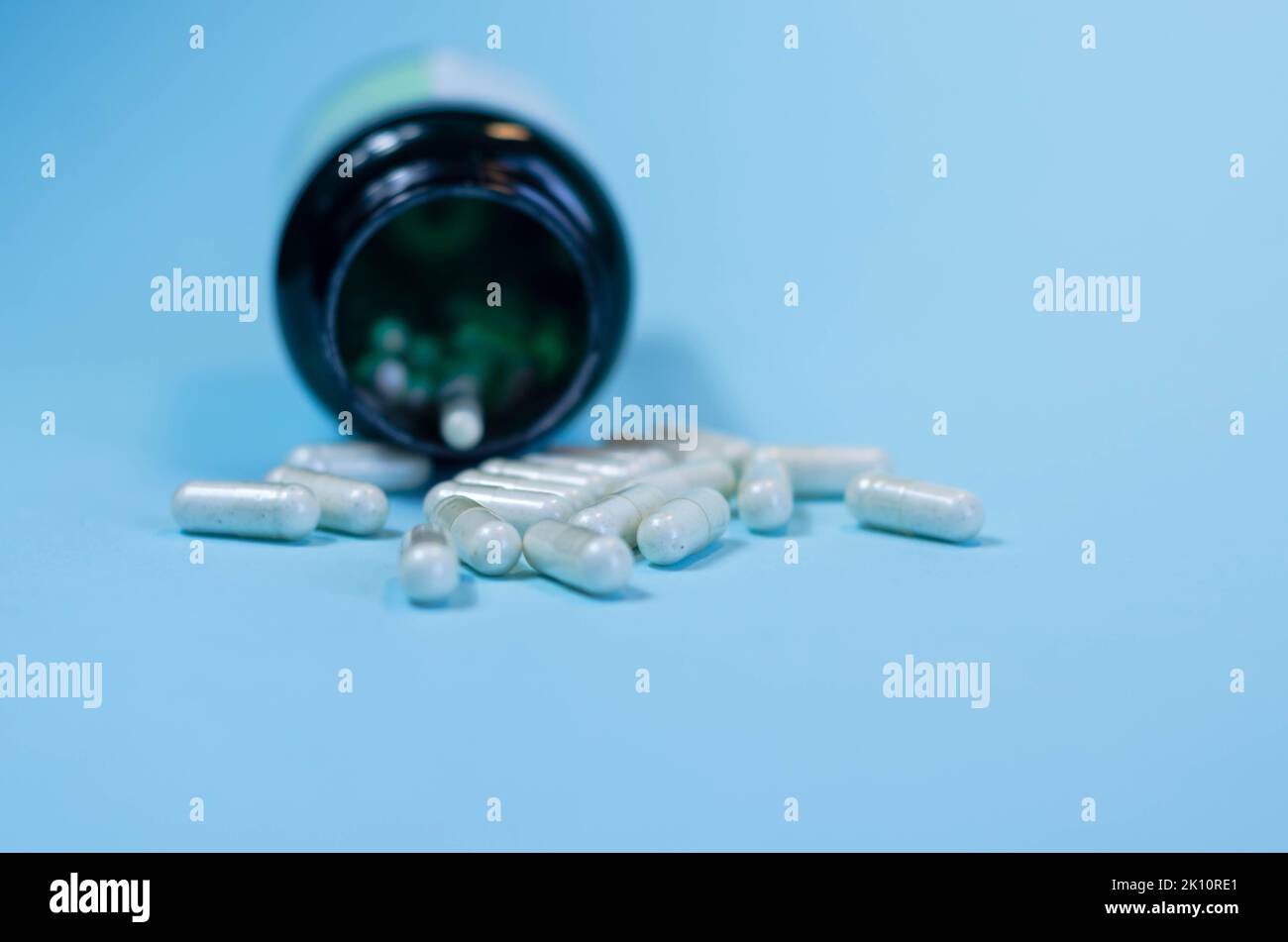 Antidepressant drugs meds, capsule and pills on blue background Stock ...