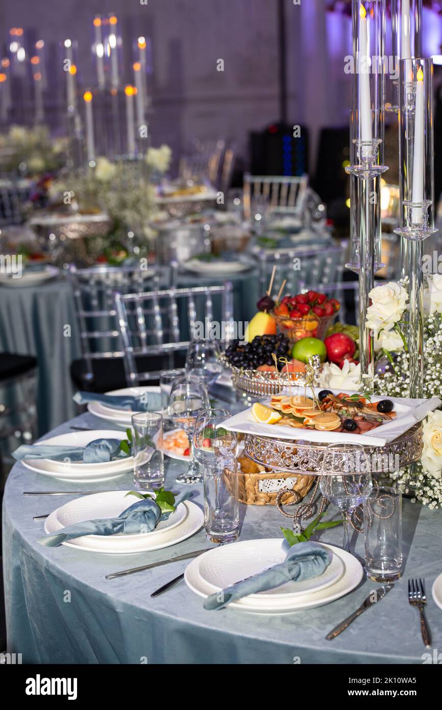 A set table for a celebration in the banquet hall Stock Photo - Alamy