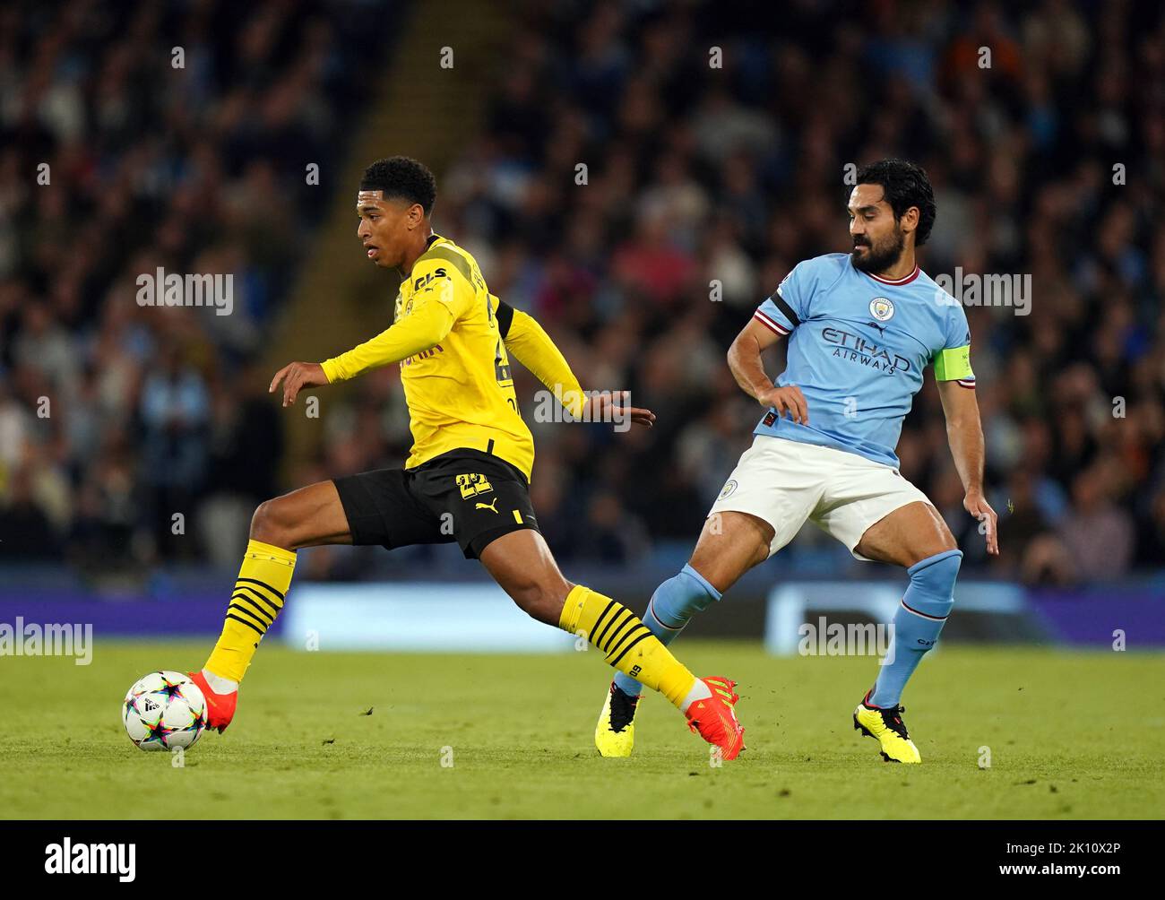 Borussia Dortmund's Jude Bellingham (left) and Manchester City's Ilkay ...