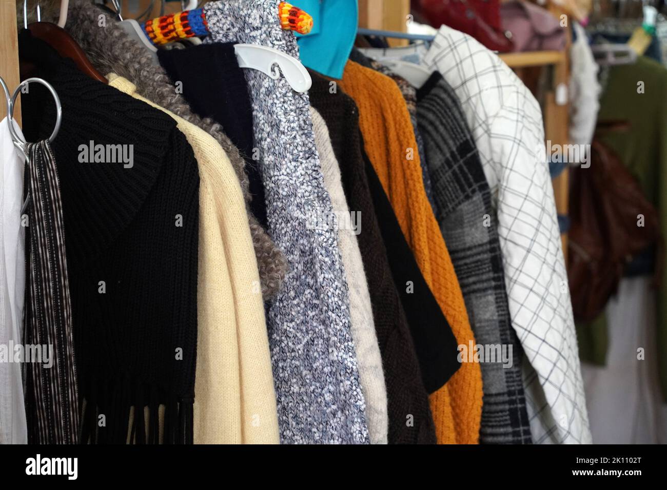 Detail of Vintage used clothes for sale inside a shop Stock Photo - Alamy