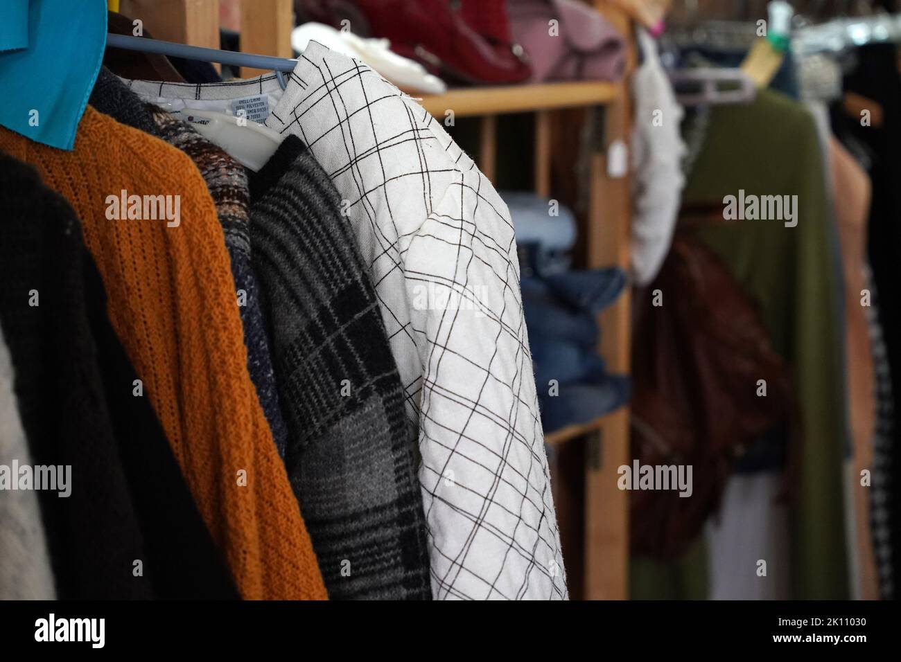 Detail of Vintage used clothes for sale inside a shop Stock Photo - Alamy