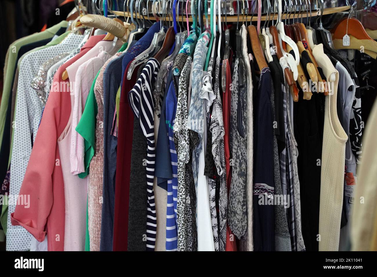 Detail of Vintage used clothes for sale inside a shop Stock Photo - Alamy