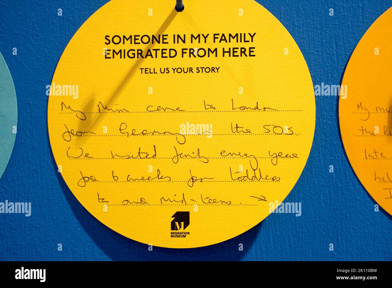 individual immigration story written on a paper discs at migration ...