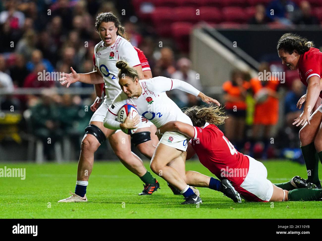 England's Sarah McKenna is tackled by Wales’ Natalia John during the ...