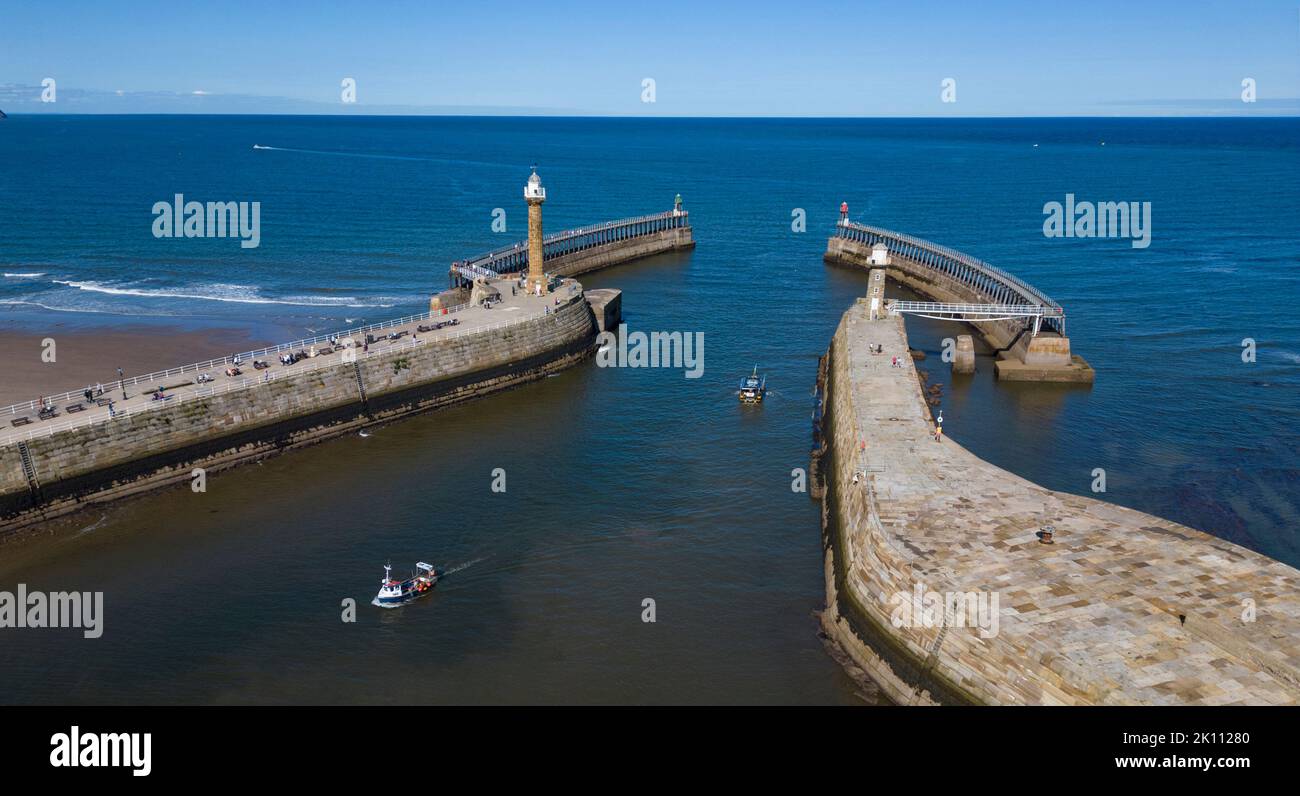 Aerial view of the twin piers at the entrance to Whitby harbor on the ...