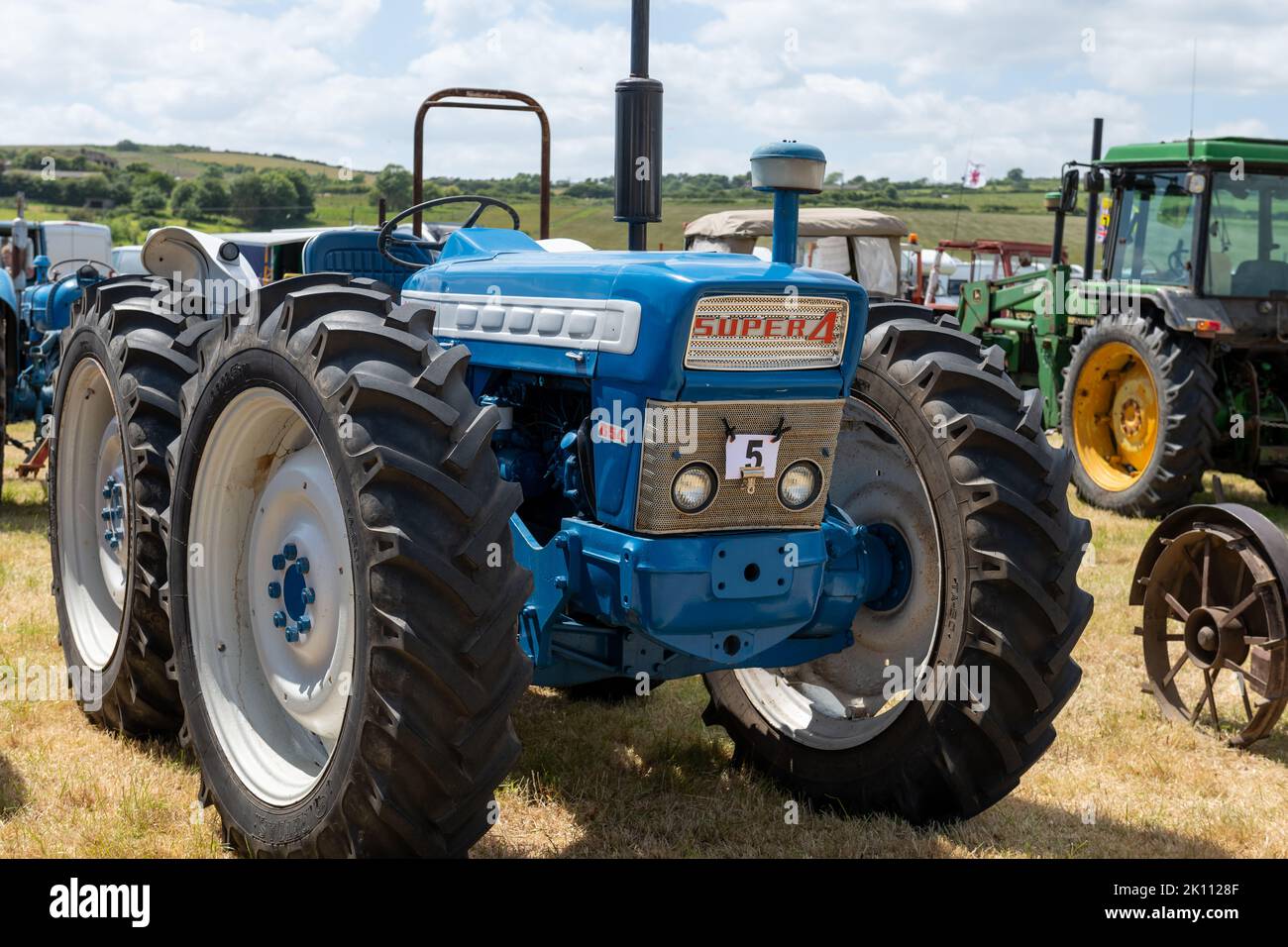 West Bay.Dorset.United Kingdom.June 12th 2022.A County 654 tractor is ...