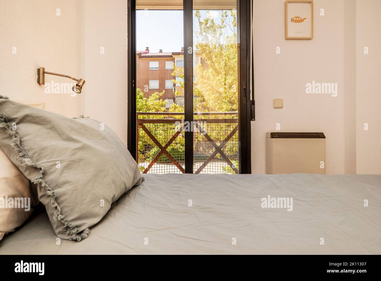 bedroom with double bed with headboard with gray cushions brown ...