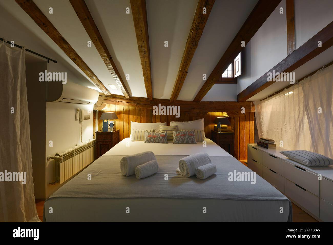 Bedroom With Double Bed Sloping Ceilings With Exposed Wooden Beams