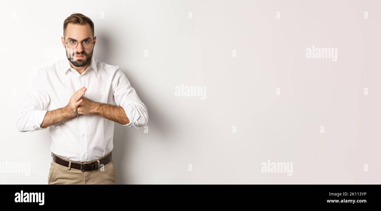 Angry man crack knuckles, want to punch someone, standing mad against ...