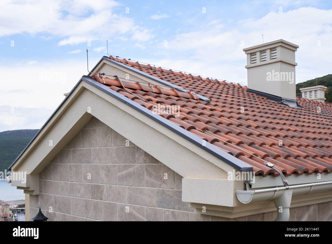 Roof made of modern polymer roofing shingles against the blue sky Stock ...