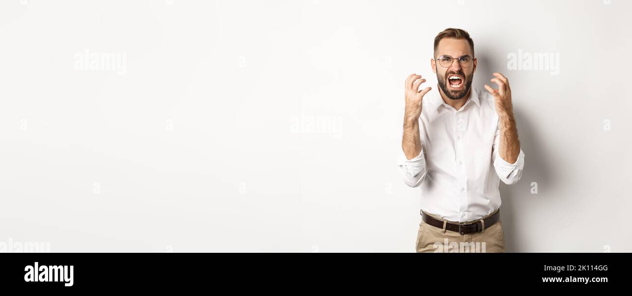 Frustrated and angry man screaming in rage, shaking hands furious ...