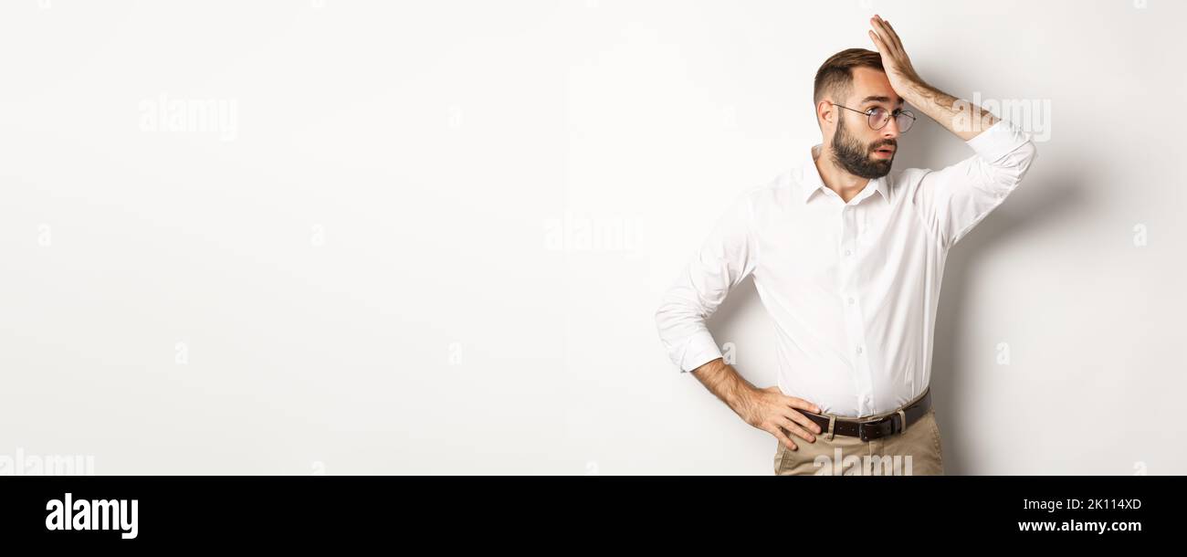 Annoyed man manager roll his eyes and slap forehead, facepalm from ...