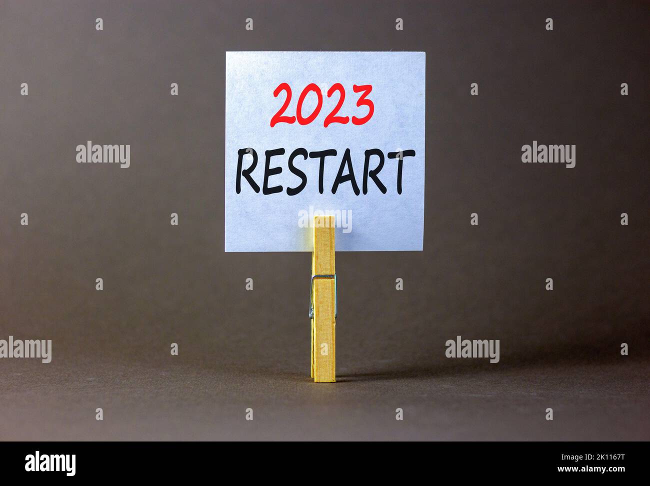 2023 Restart symbol. White paper with words 2023 Restart, clip on ...