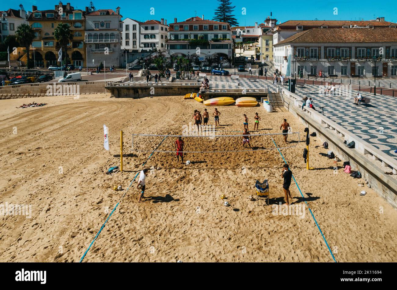 Aerial drone view of young people playing footvolley, a combination ...