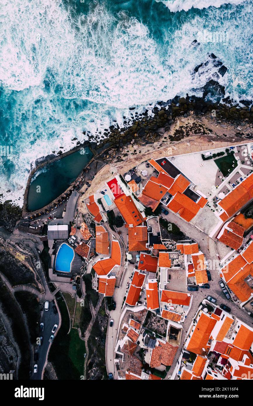 Aerial view of Azenhas do mar from top, view of red rooftop of a small ...