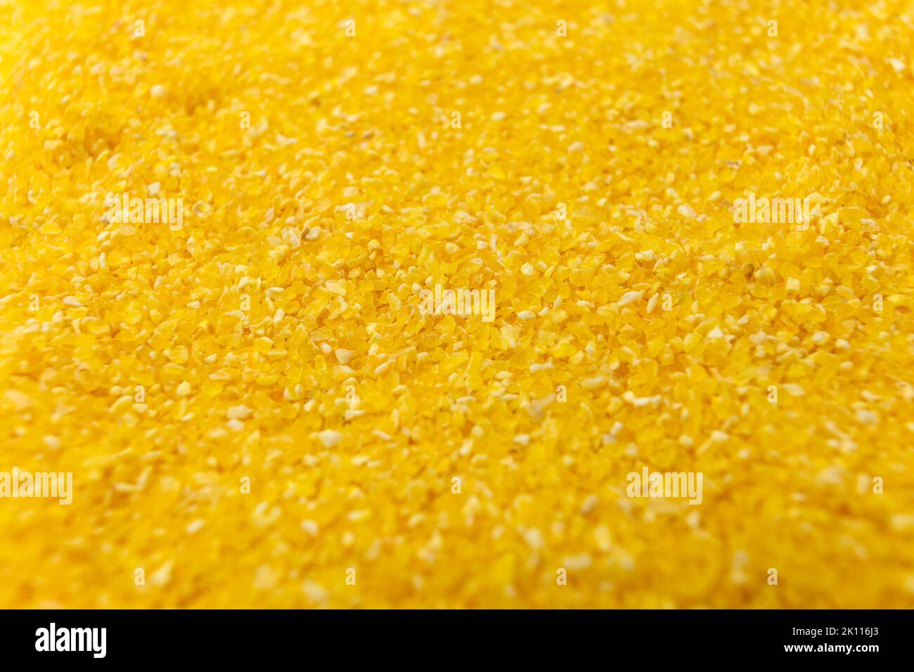 corn grits background. nutrition. food ingredient. shallow depth of ...