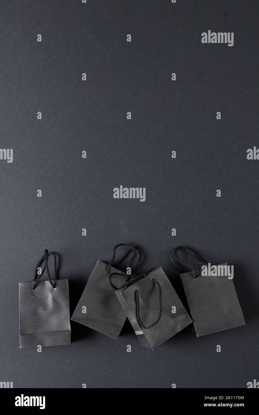 Composition of gray paper shopping bags on gray background Stock Photo ...