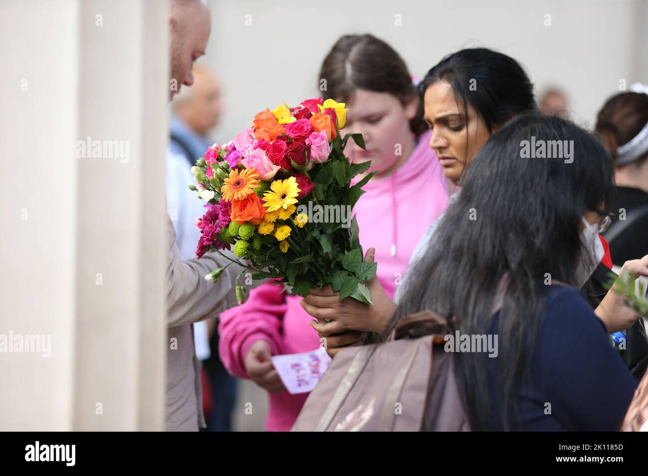 LONDON, ENGLAND - SEPTEMBER 14: A mourner lays flowers at the Queen ...