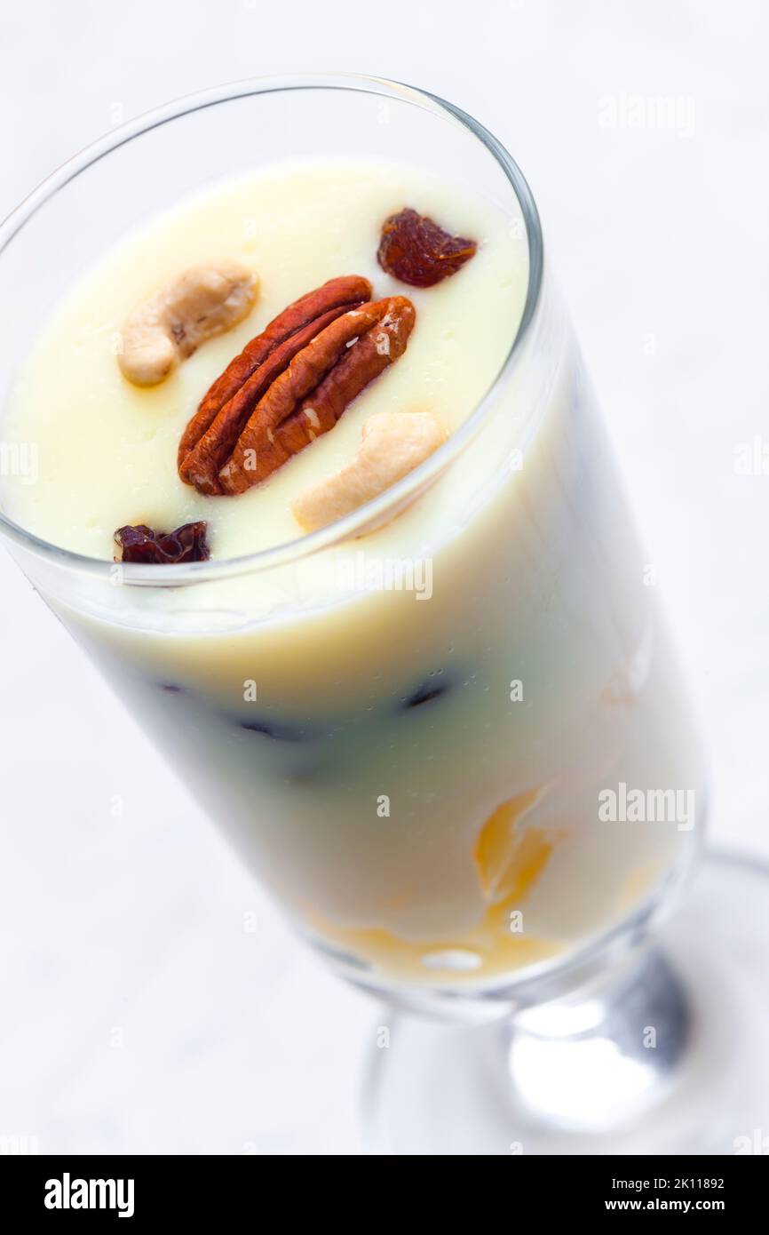 vanilla custard with nuts and raisins in a glass Stock Photo - Alamy