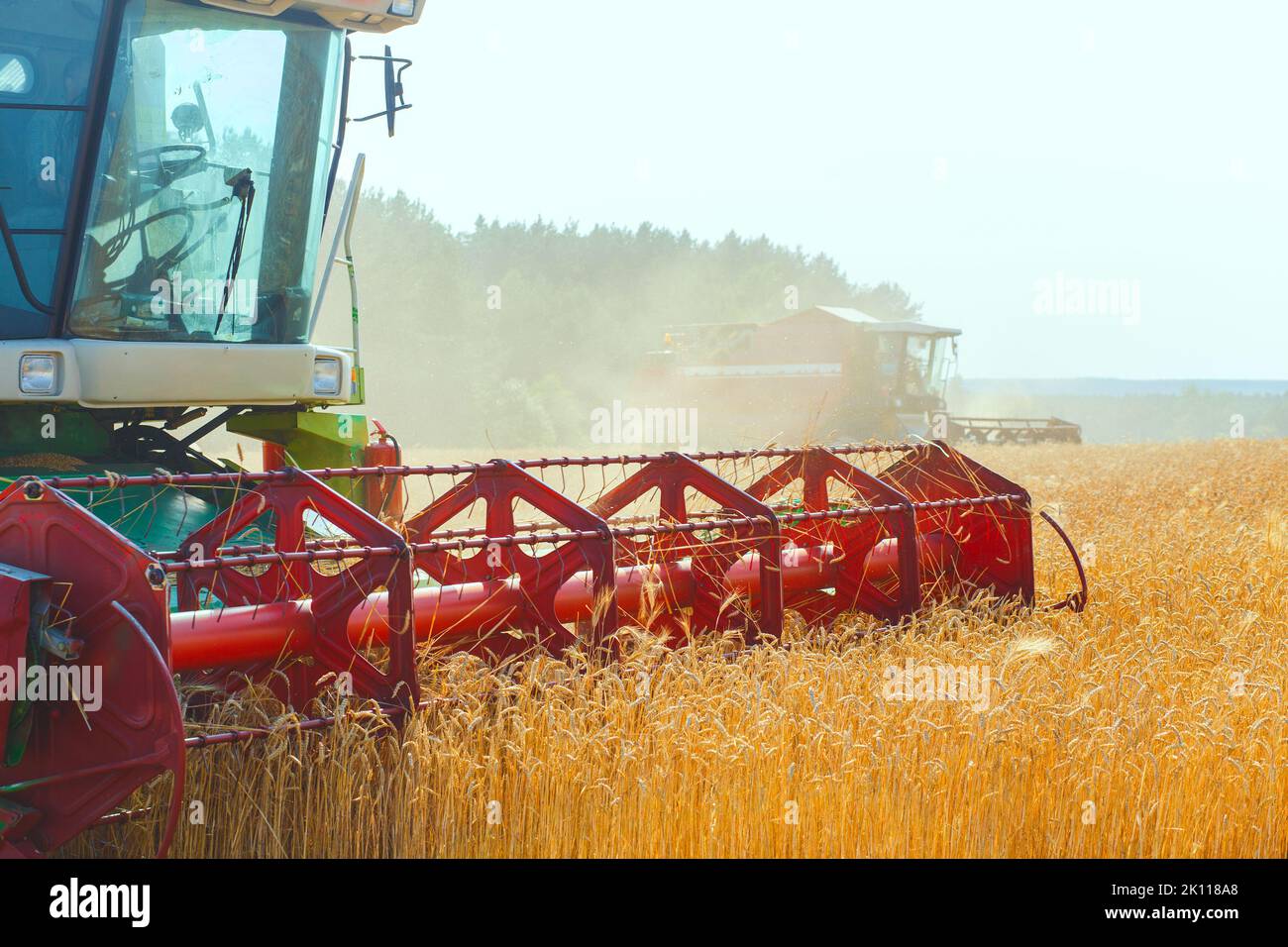 combine harvester working on a barley field Stock Photo - Alamy