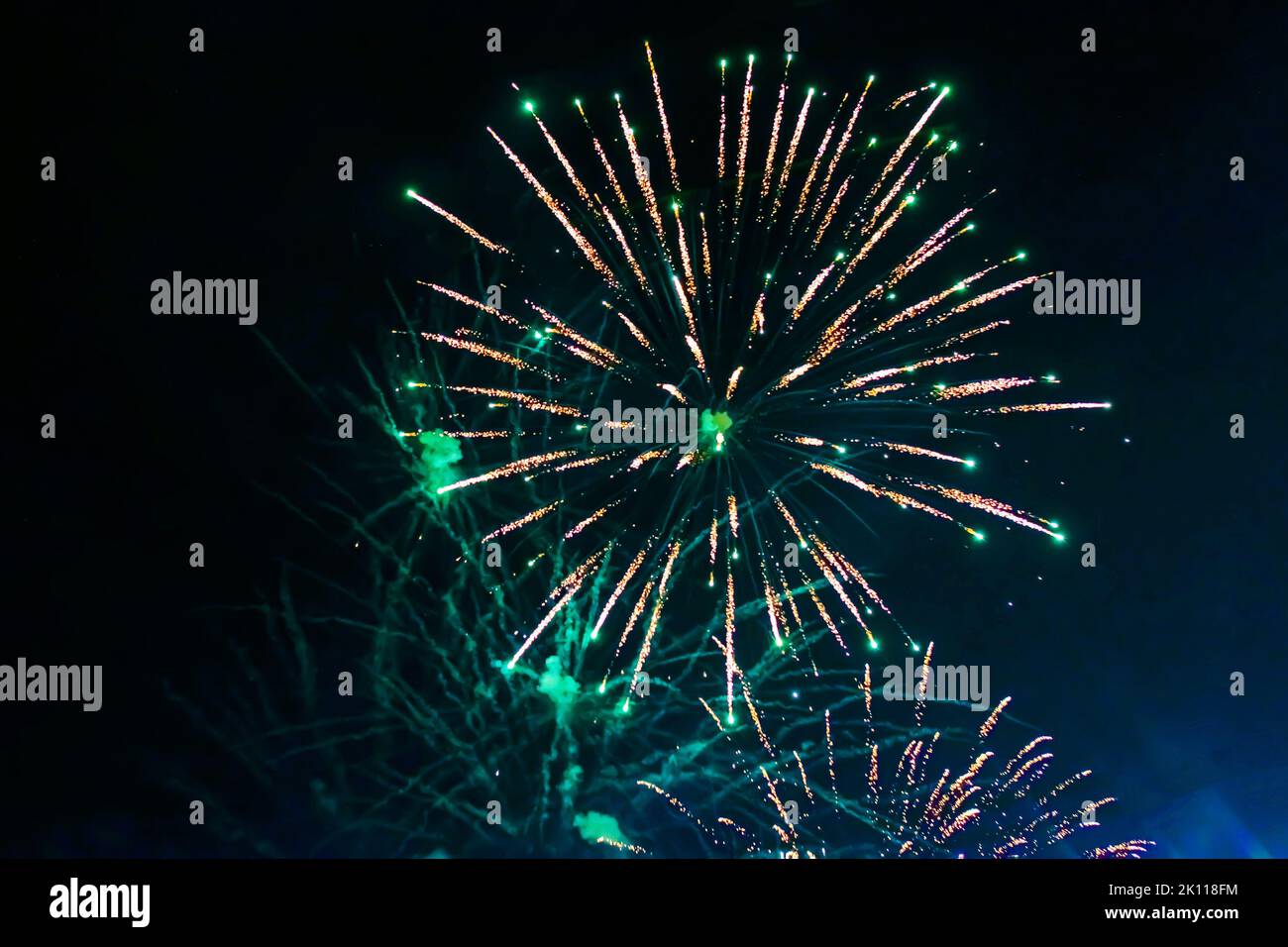 An explosion of bright single fireworks, against the background of the ...