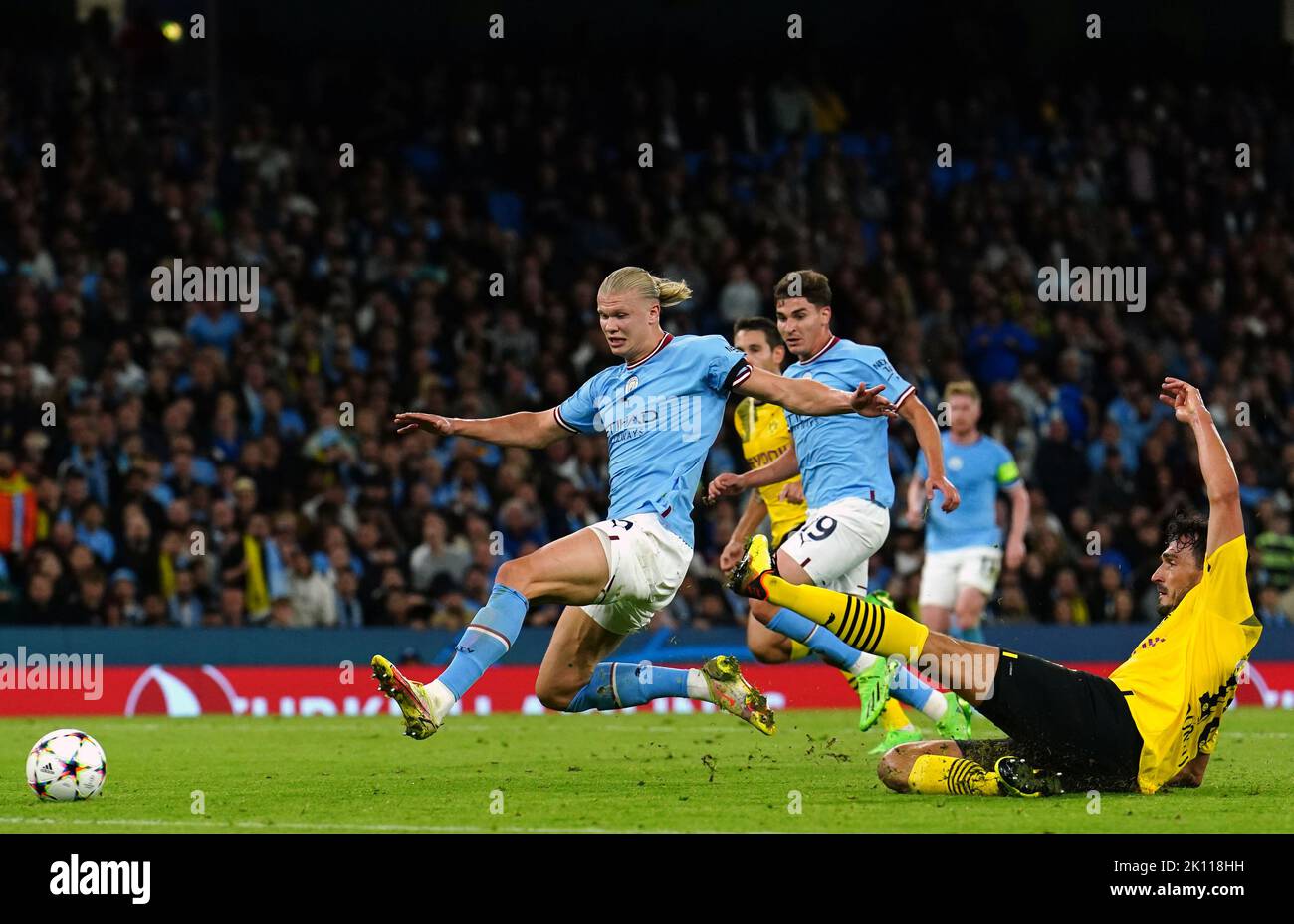 Manchester City's Erling Haaland (left) challenged by Borussia Dortmund ...