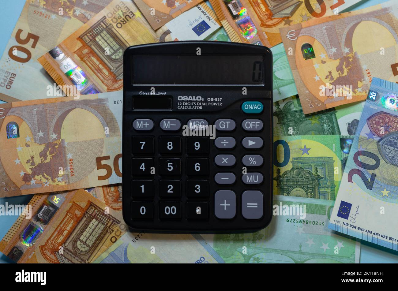 Stack pile of 100 50 Euro banknotes and a calculator Stock Photo - Alamy