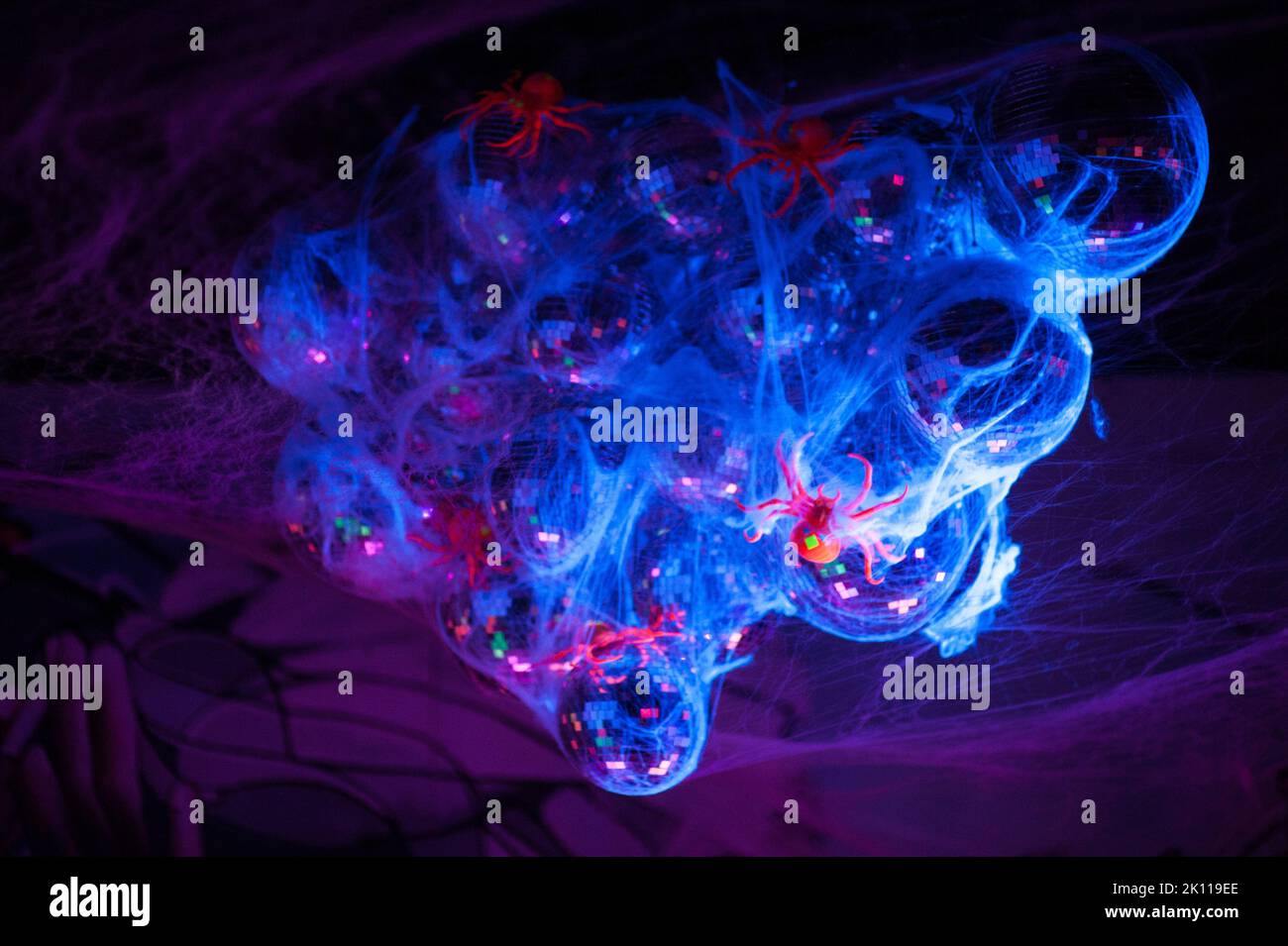 Cluster of disco balls covered in cobwebs on the ceiling of a cool ...