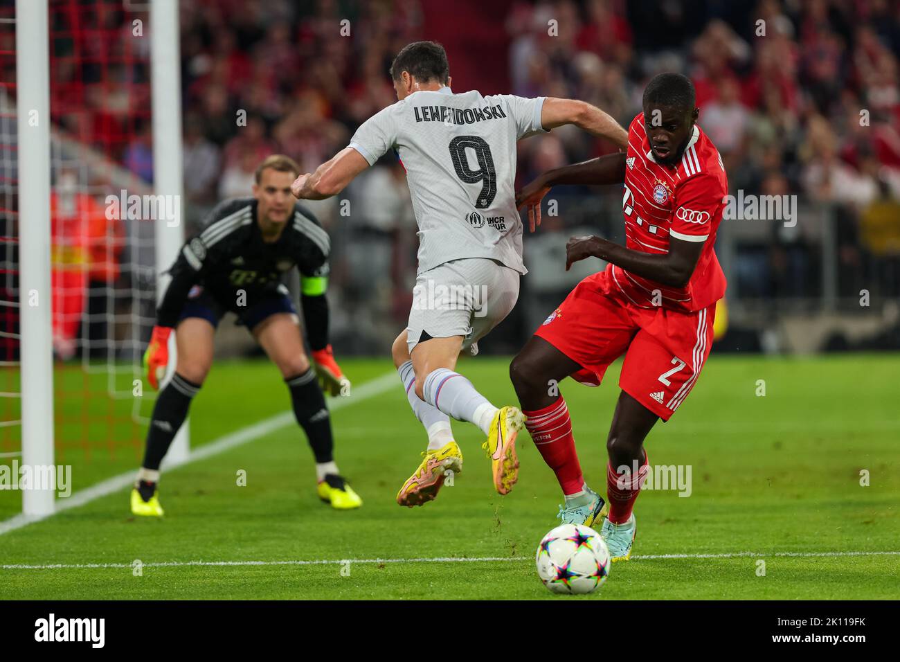 Robert Lewandowski of FC Barcelona in action with Dayot Upamecano of FC ...