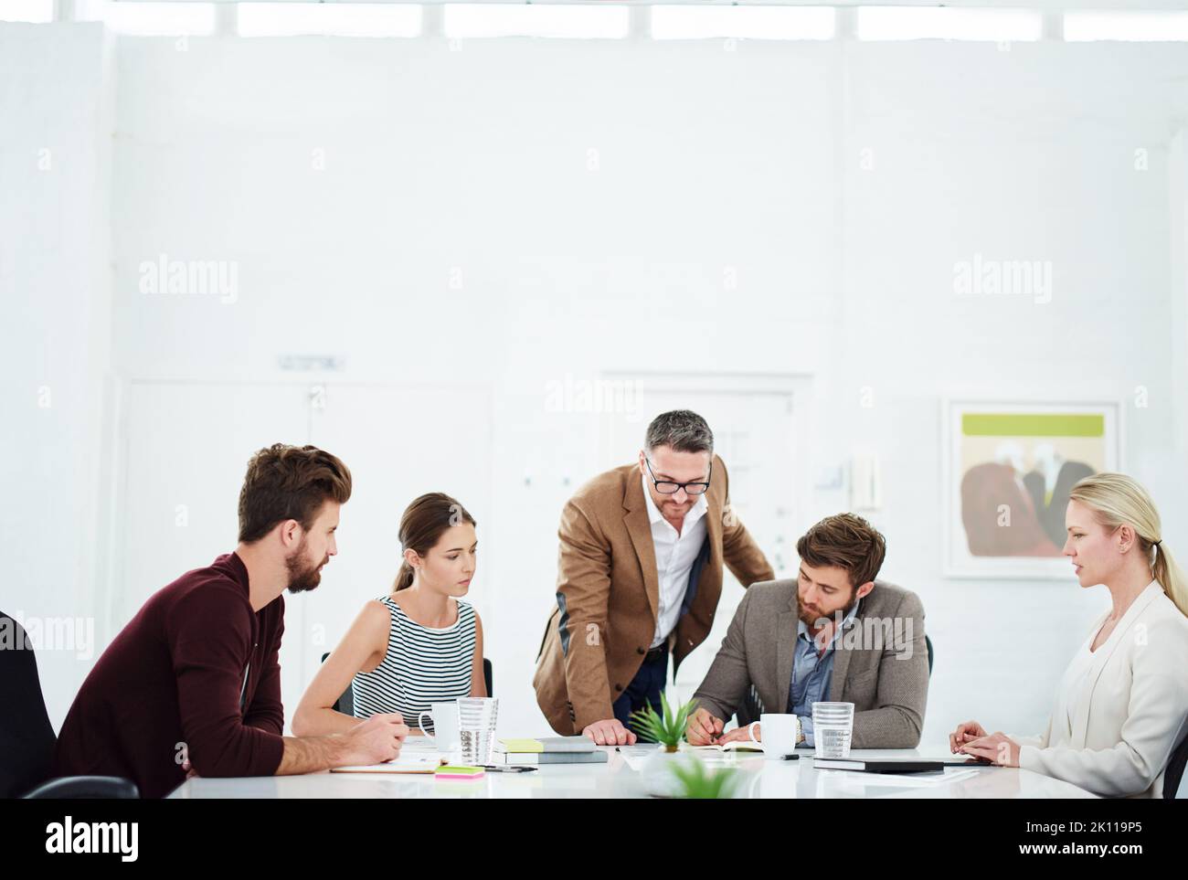 Talking design in the office. a group of designers having a meeting ...