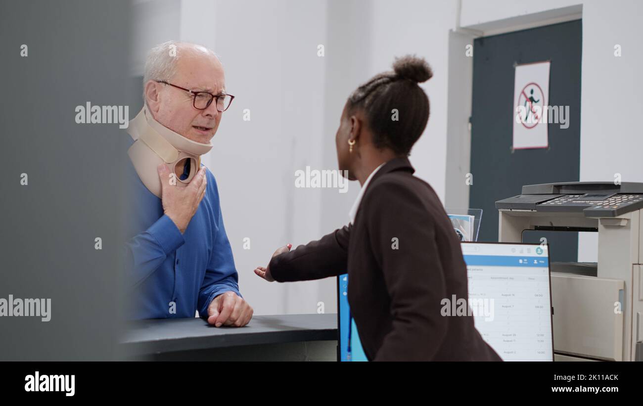 Old patient with cervical foam asking for medical support at hospital ...