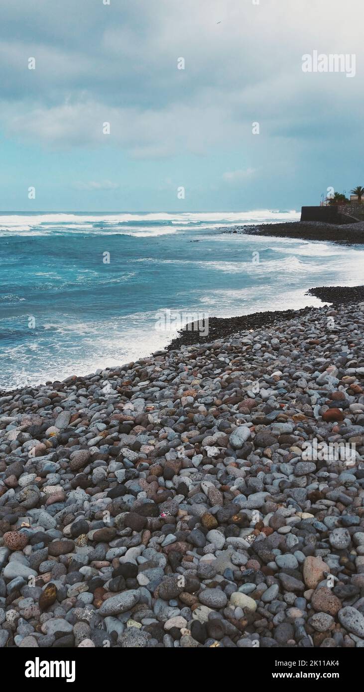 Beautiful Pebble Beach Sea with cloudy weather in Tenerife Stock Photo ...