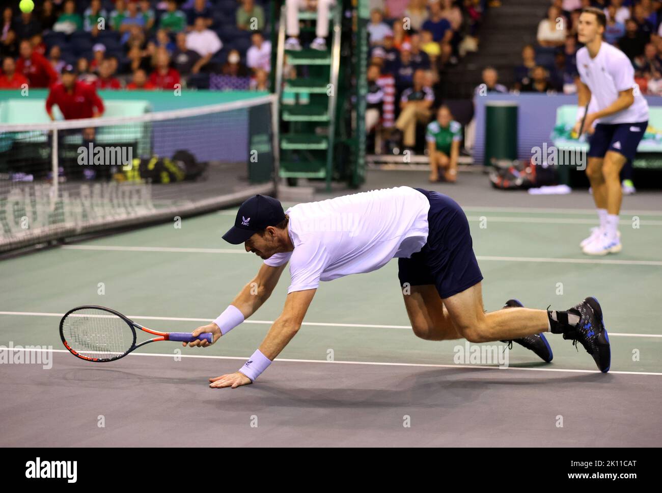 Great Britain's Andy Murray falls whilst competing in his doubles match ...