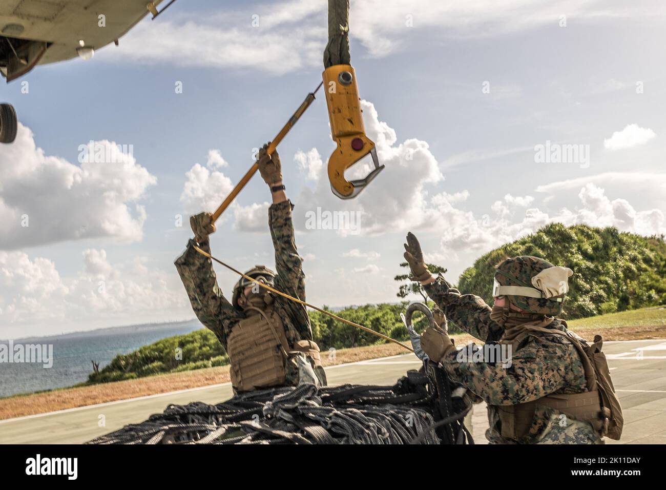 U.S. Marines with Combat Logistics Battalion 4 prepare to attach a ...