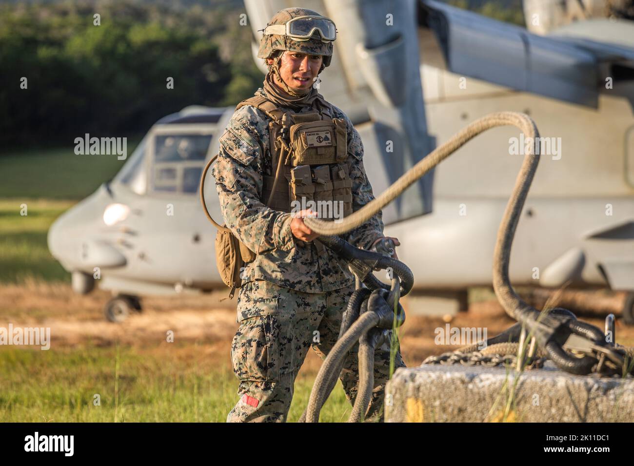 A U.S. Marine with Combat Logistics Battalion 4 prepares to attach a ...